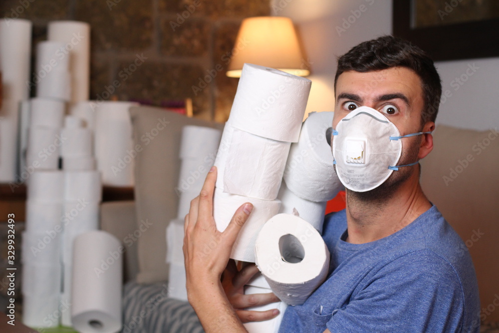 Man hoarding toilet paper during pandemic Stock Photo | Adobe Stock
