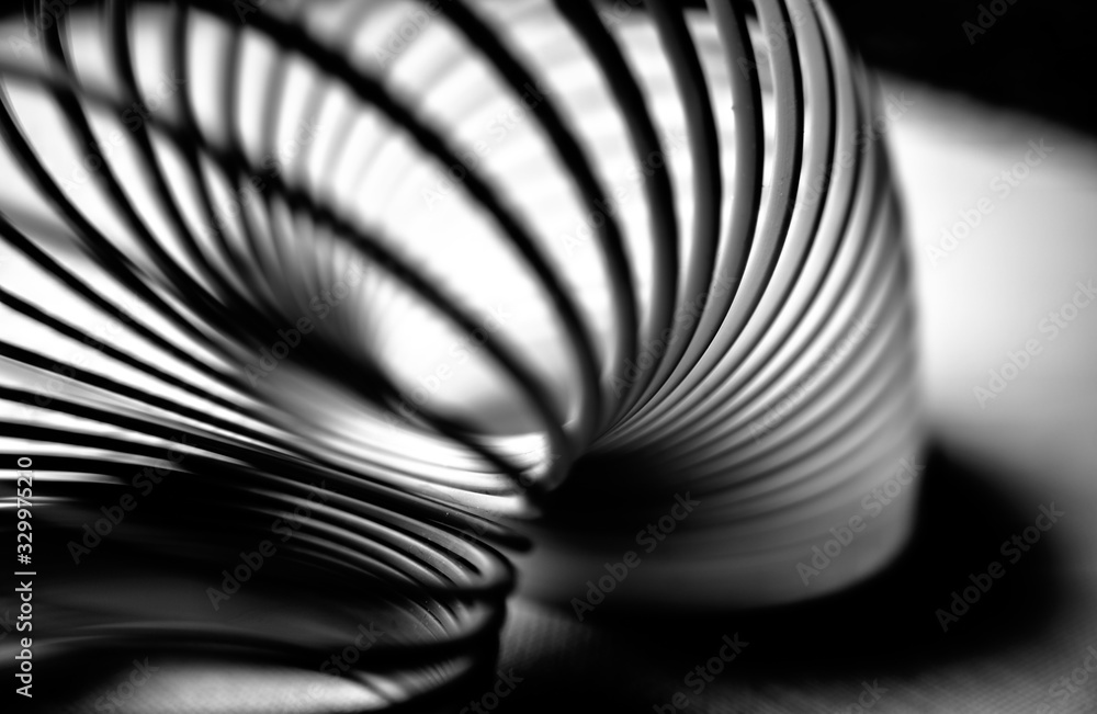 Black and white flexible bouncy plastic spring bent into an arch Stock ...