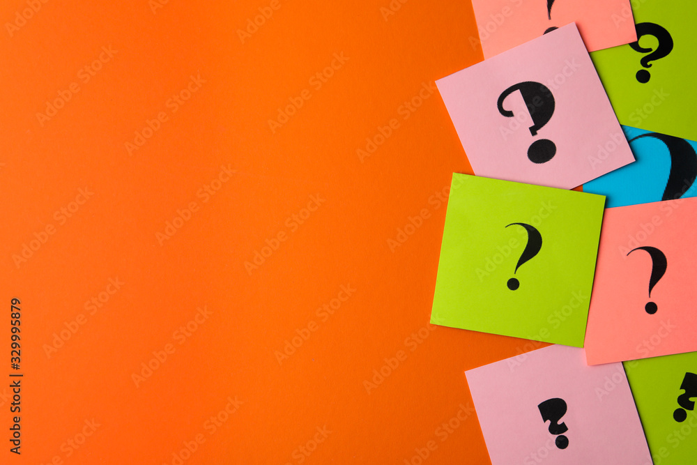 Paper cards with question marks on orange background, flat lay. Space ...