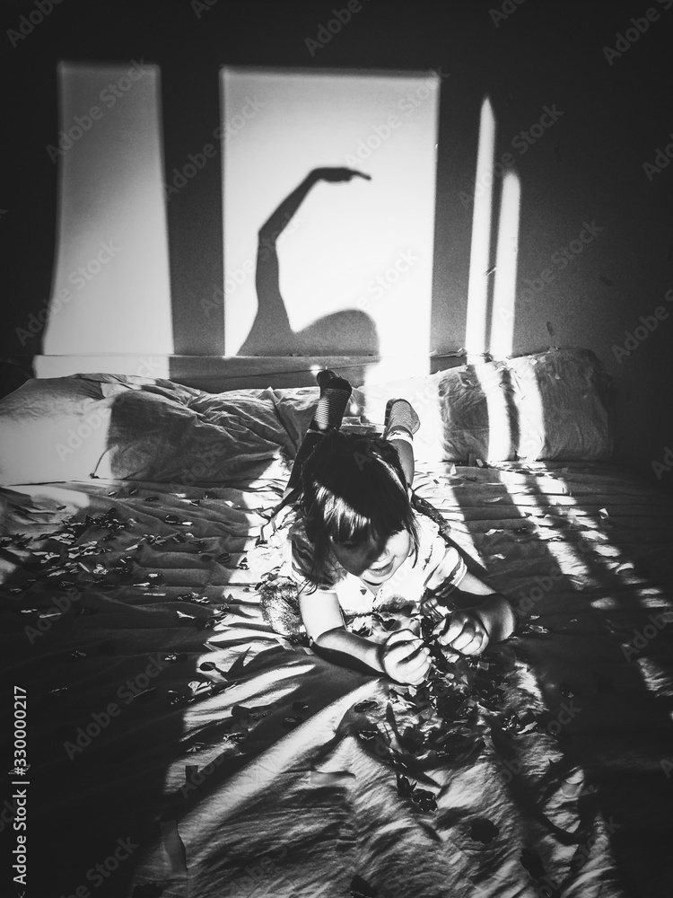 Girl Lying On Bed With Human Shadow In Background Stock Photo | Adobe Stock