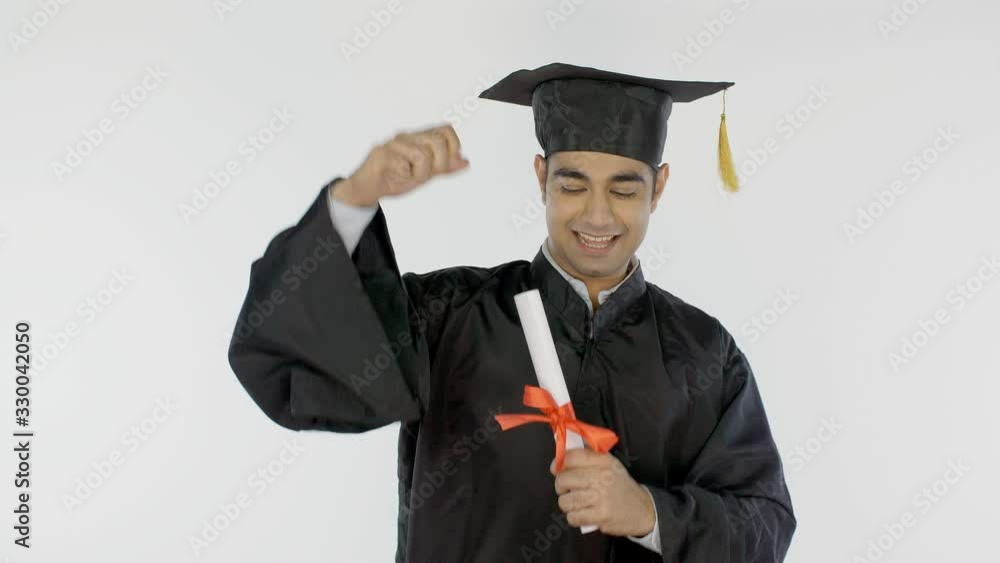 Attractive Indian graduate rejoicing on the day of convocation ceremony ...