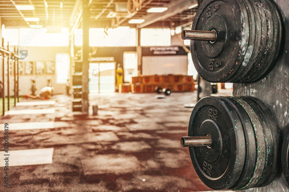 Rusty weight stack in a gym sunny day with copy space for banner ...