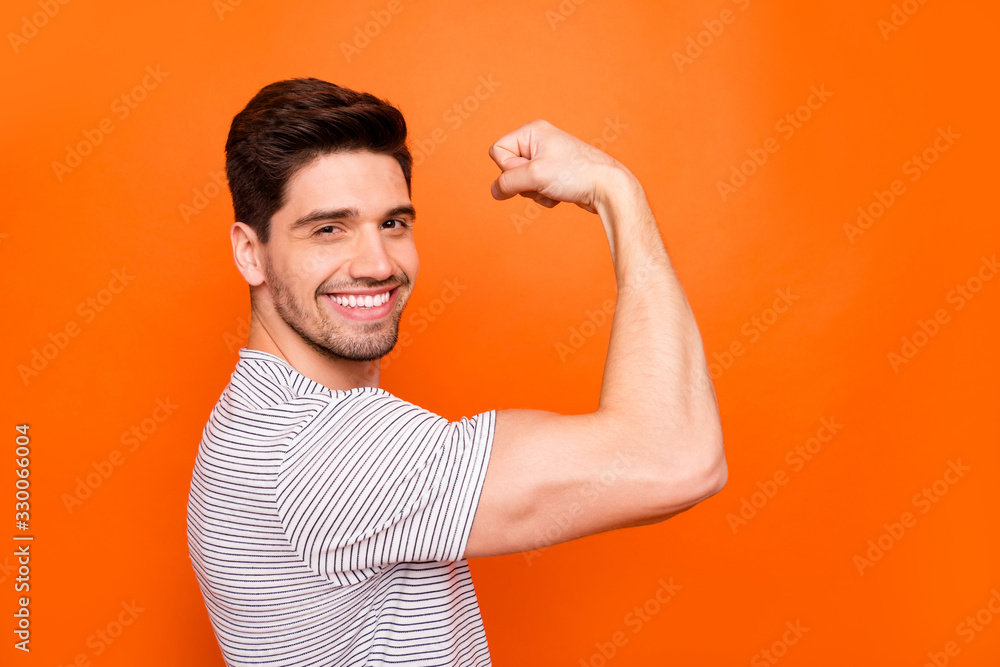 Profile photo of cool self-confident guy raise fist arm showing strong ...