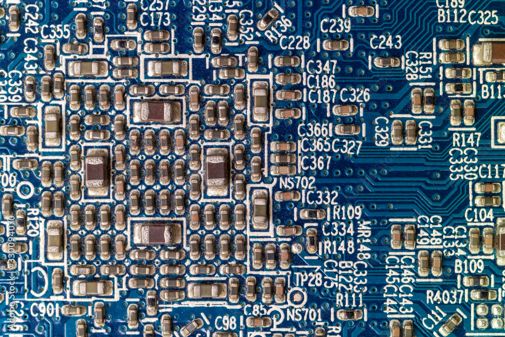 Macro close up view of a blue circuit board full of transistors Stock ...