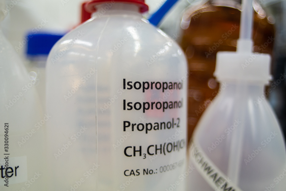 Set of empty plastic chemical bottles with straws in a lab environment ...