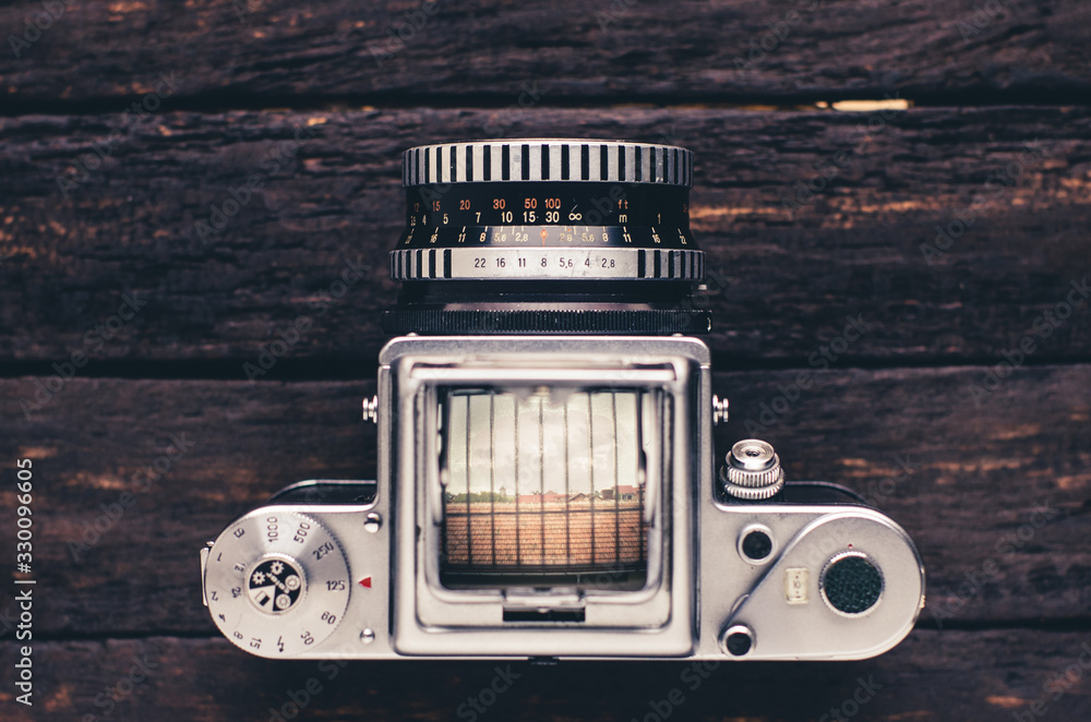 Old vintage medium square format SLR style camera top view sitting on ...