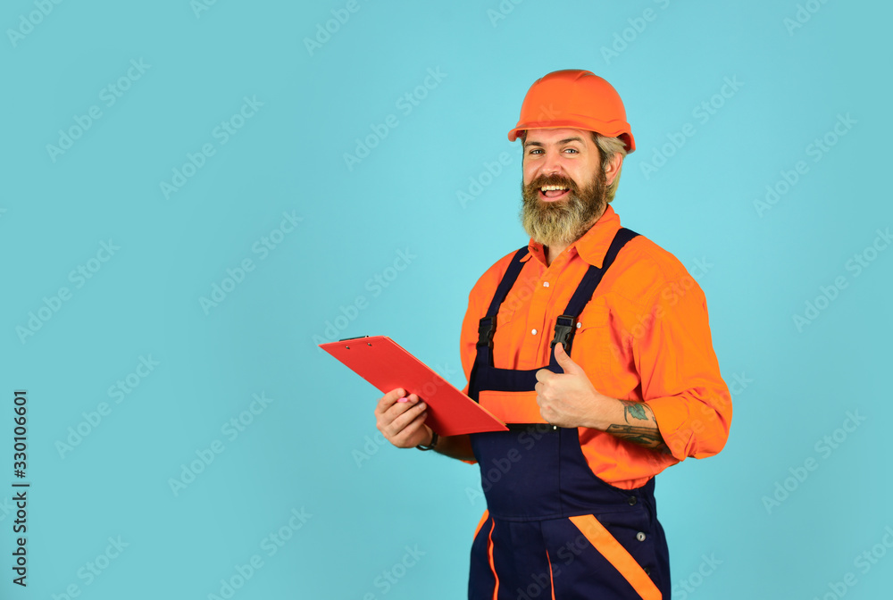 looking project folder. blueprint in folder. making notes in clipboard ...