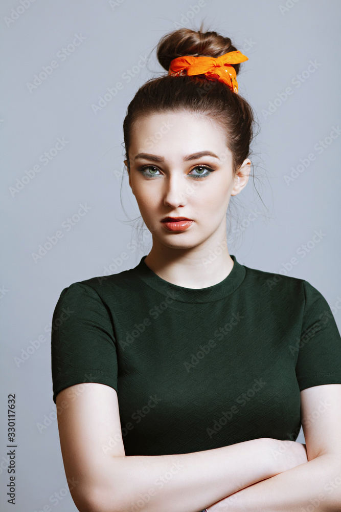 portrait of confident beautiful girl with with hairstyle on studio ...