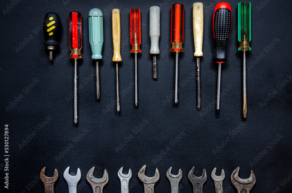 Screwdrivers of different shapes, sizes and colors for repair and ...