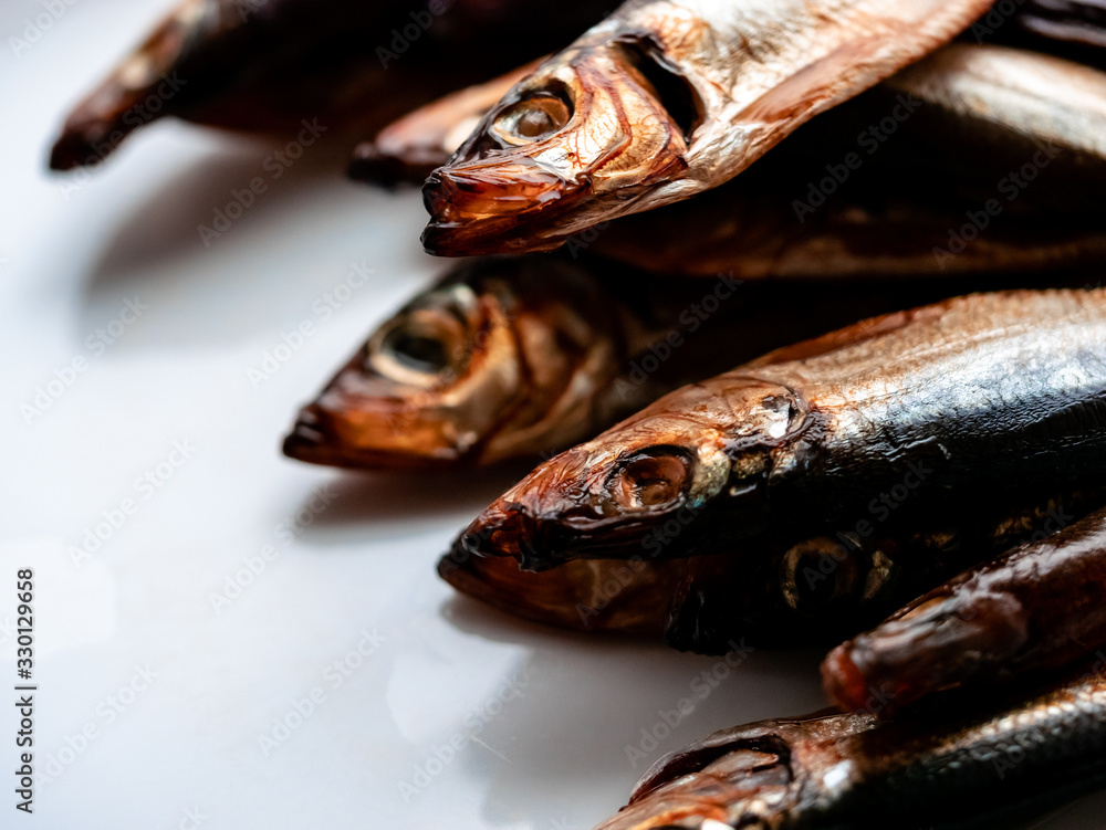 Cold smoked salaka ready to eat. Smoked fish close-up on a plate. Sea ...