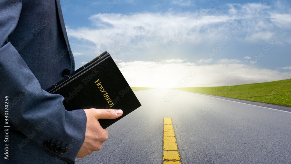 man holding bible in his hand. Concept for faith, spirituality and ...