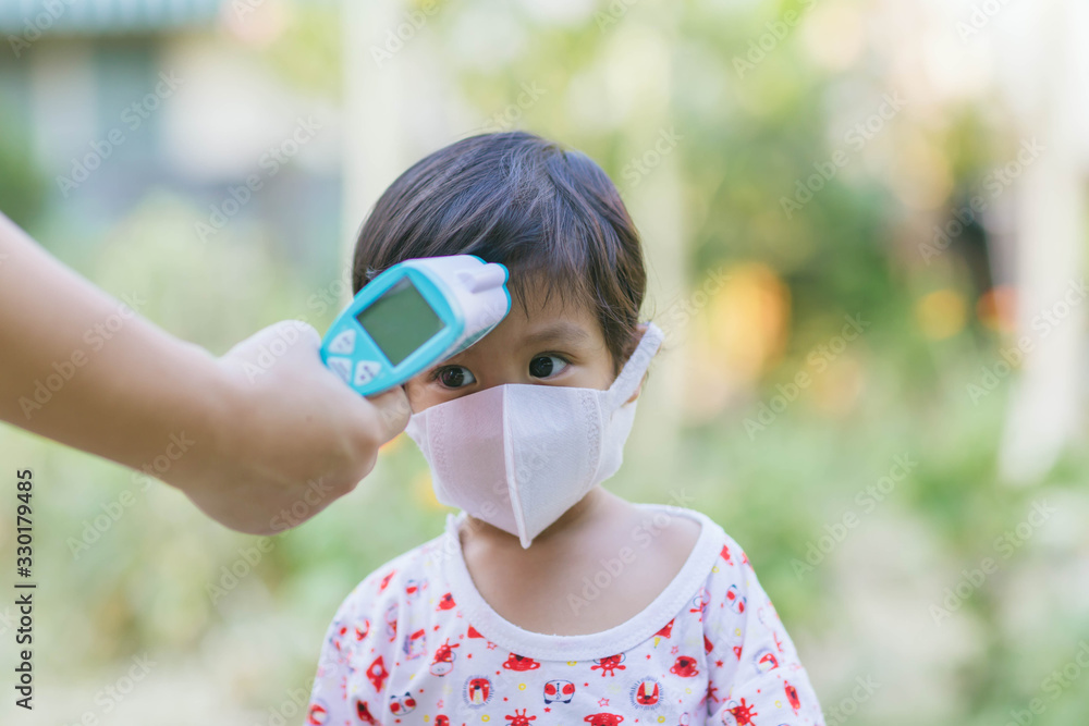 Doctor measuring temperature cute baby boy at hospital . Mother takes ...