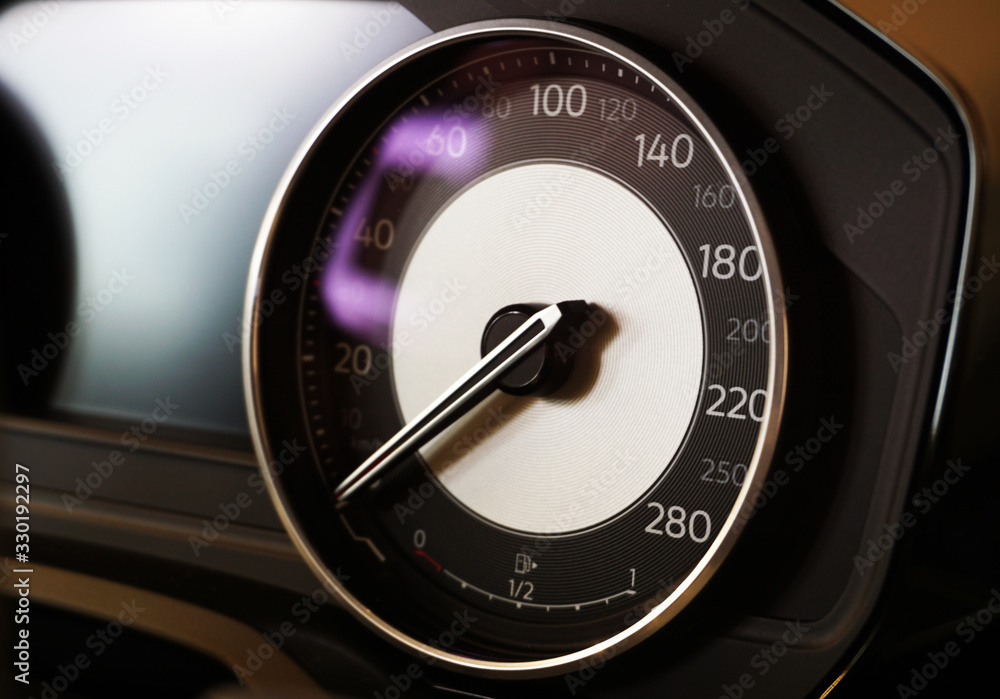 Speedometer of a modern luxury car with a built-in fuel gauge in the ...