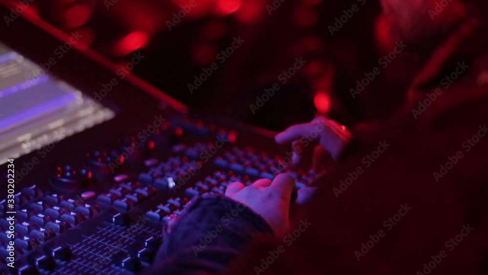 Audio mix desk at a concert. Man working on professional digital audio ...