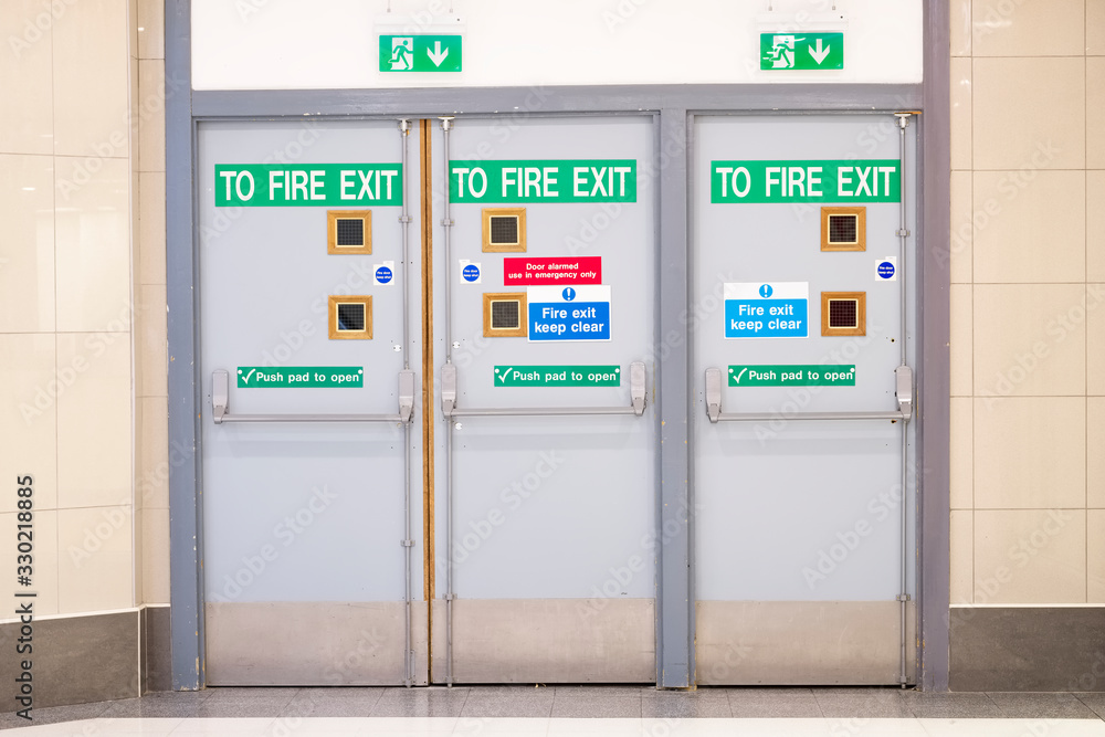 Fire exit glass door at indoor shopping mall for emergency use Stock ...