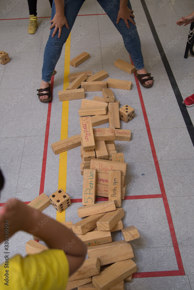 Kids playing huge jenga at a fundraising event Stock Photo | Adobe Stock