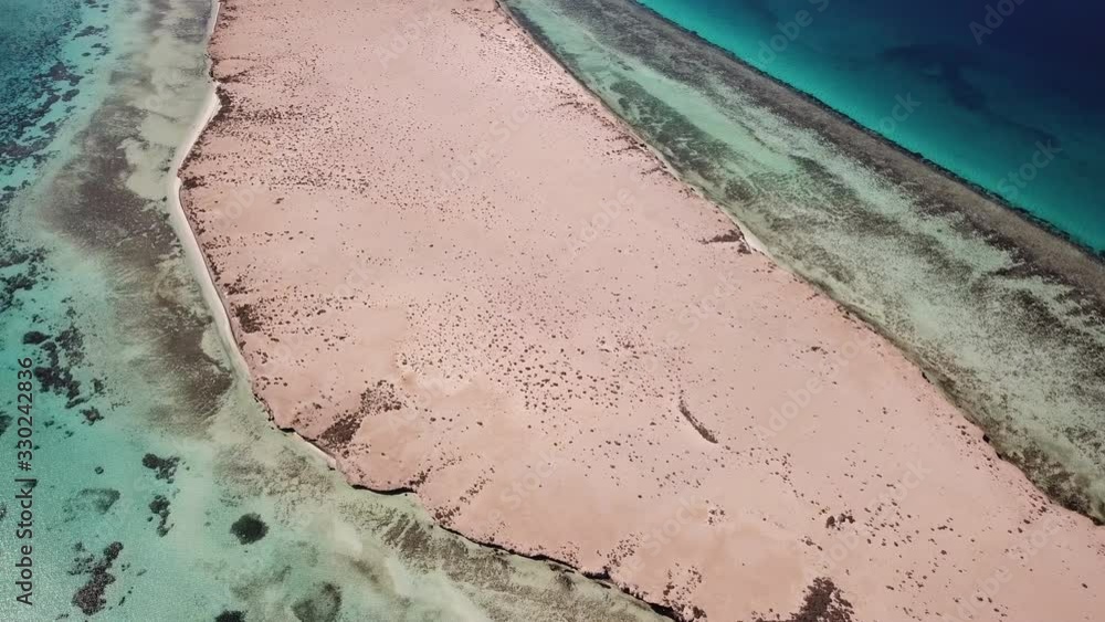 Flying over beautiful untouched beaches and turqoise blue waters of the ...