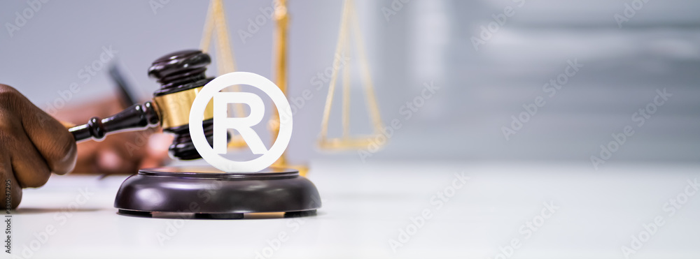 Judge Striking Mallet On Trademark Symbol Stock Photo | Adobe Stock