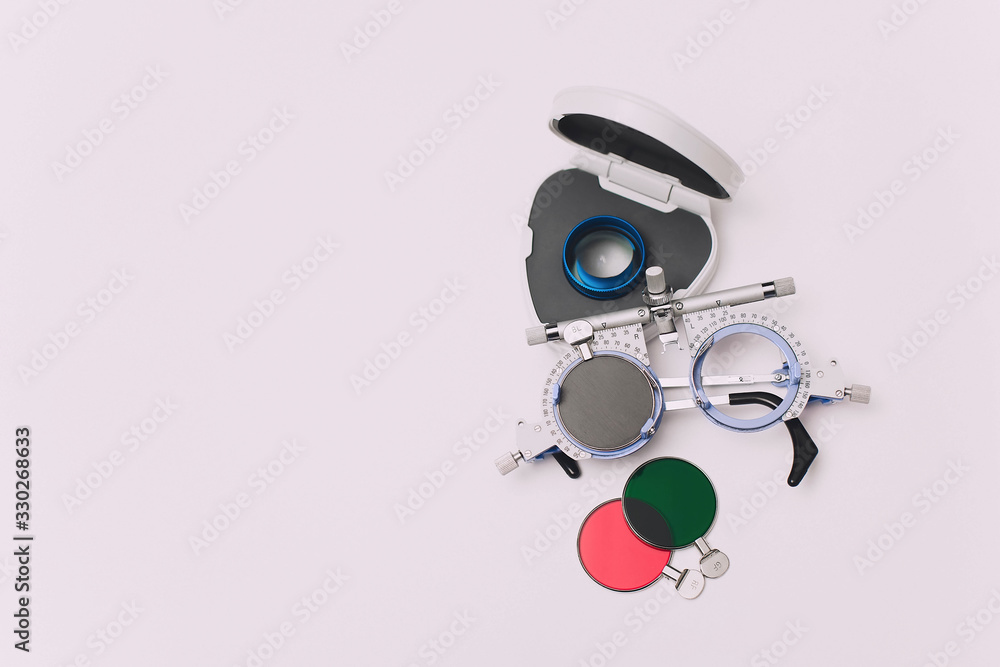 Optometrist trial frame on white background and Indirect Ophthalmoscopy ...