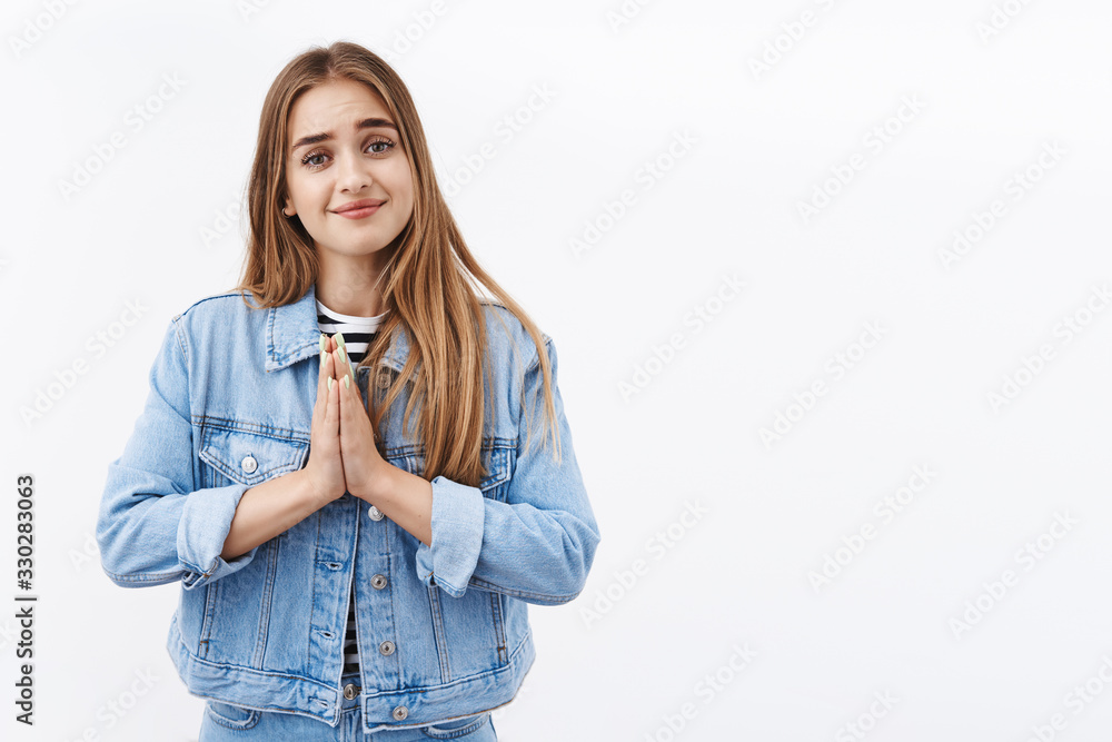 Lovely and hopeful kind blond girl begging for favour, nicely smiling ...