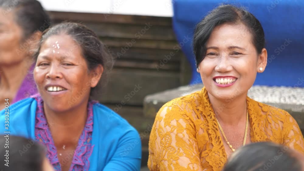 Women laugh, smile and talk while gathered at local Hindu temple in ...