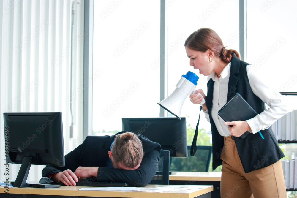 Staff officer taking a nap on the office desk, employee sleeping at the workplace. Angry ...