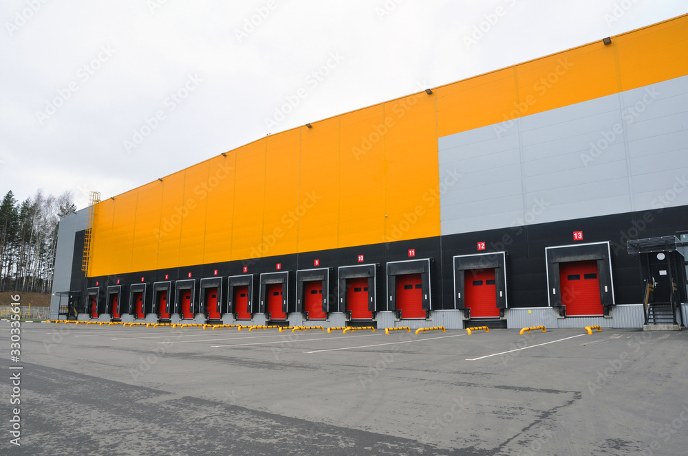 The building of a modern logistics center. Front view of loading docks ...