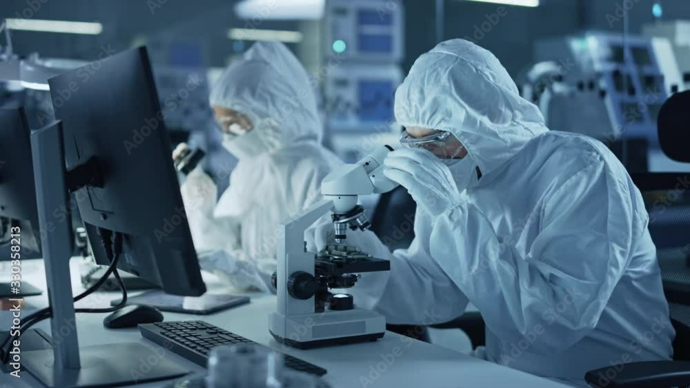 Research Factory Cleanroom: Engineers / Scientists wearing Coveralls ...