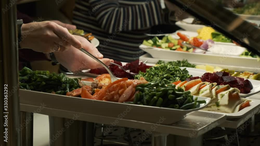 Buffet table at the restaurant. Hot and fresh food at a mall food court ...