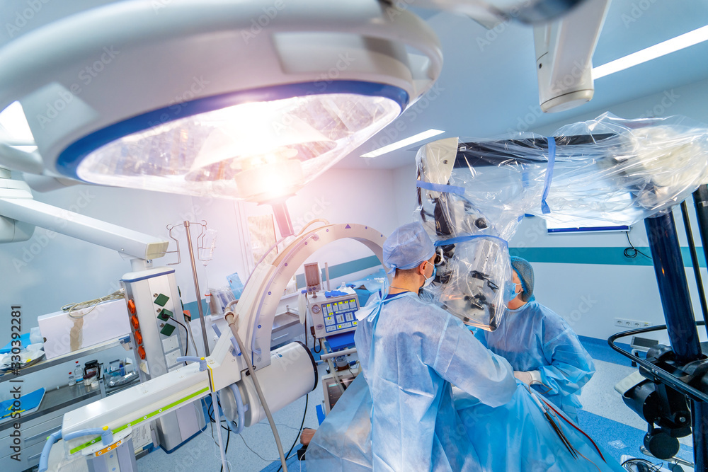 Surgeons working in operating room. Hospital background. Doctors at ...