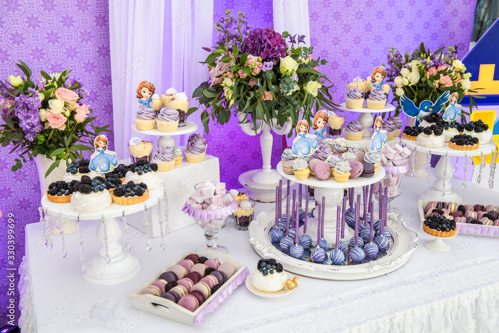 Little girl birthday party table with princess cake, macaroons ...