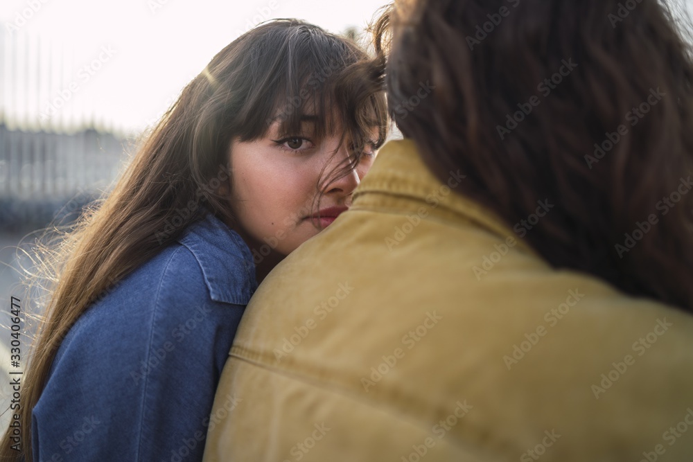 Girls sitting closely next to each other in a park Stock Photo | Adobe ...