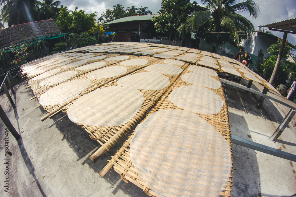 Rice paper sun drying. Traditional rice paper production in Vietnam ...