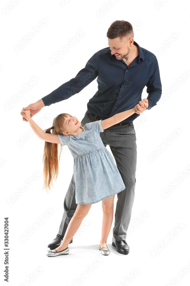 Father and his little daughter dancing against white background Stock ...