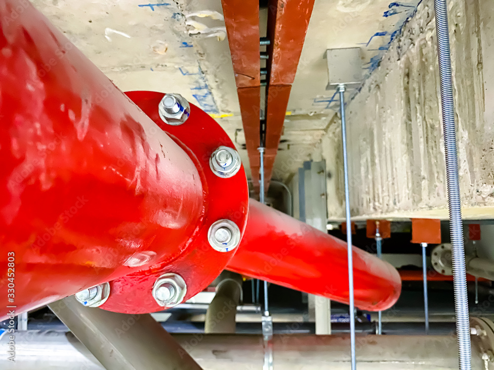 Blurred Fire pump system with big red pipe line system background Stock ...