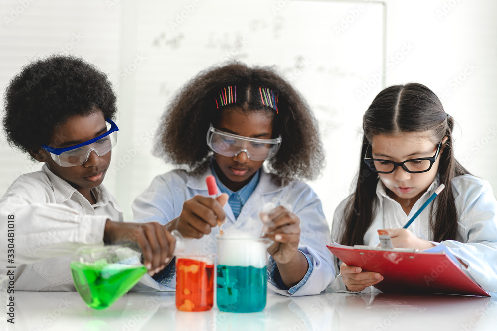 Group of teenage cute little students child learning research and doing ...