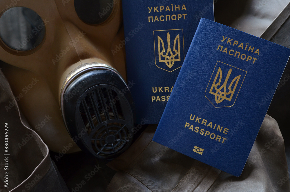 Concept. Ukrainian passport and gas mask. Ukrainian health collapse and ...