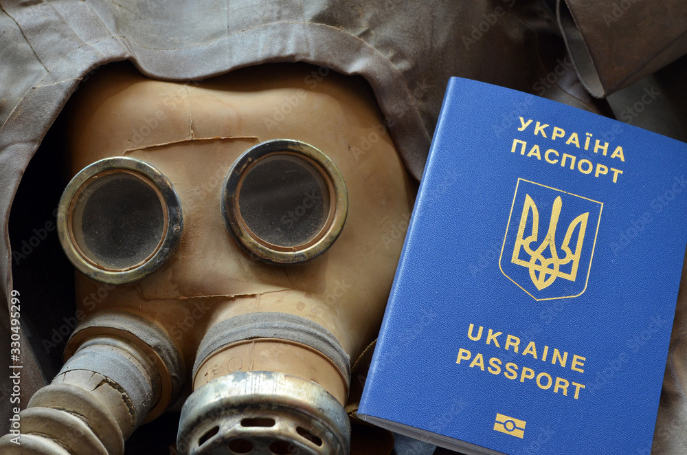 Concept. Ukrainian passport and gas mask. Ukrainian health collapse and ...