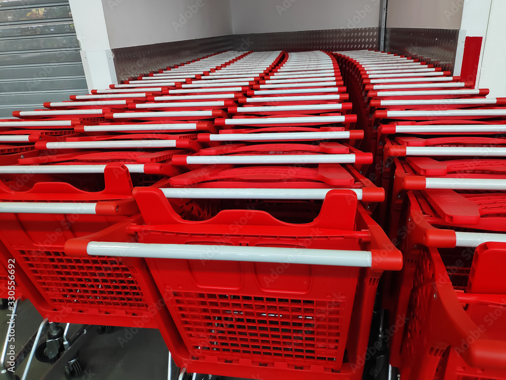 Row of shopping carts parking in the supermarket. Concept of shopping ...