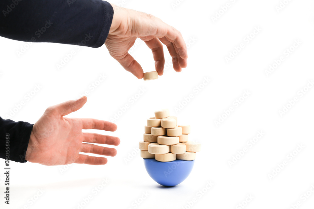 Risk management concept on white background. hand holds an additional ...