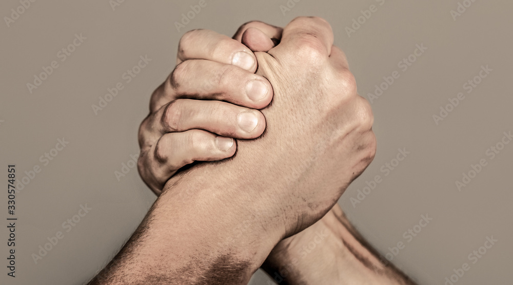 Two men arm wrestling. Arms wrestling. Friendly handshake, friends ...
