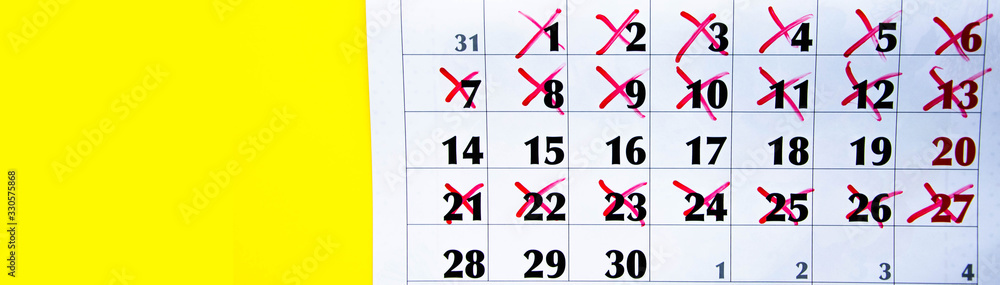Numbers on the calendar crossed out with a red cross in macro on a ...