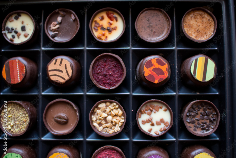 Various of sweet confectionery with chocolate candies and pralines ...