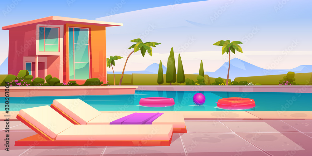 House and swimming pool with deck chairs on poolside and balls in water ...