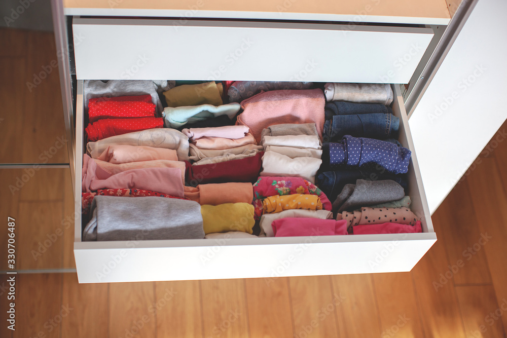Vertical storage of clothing. Clothing folded for vertical storage in ...