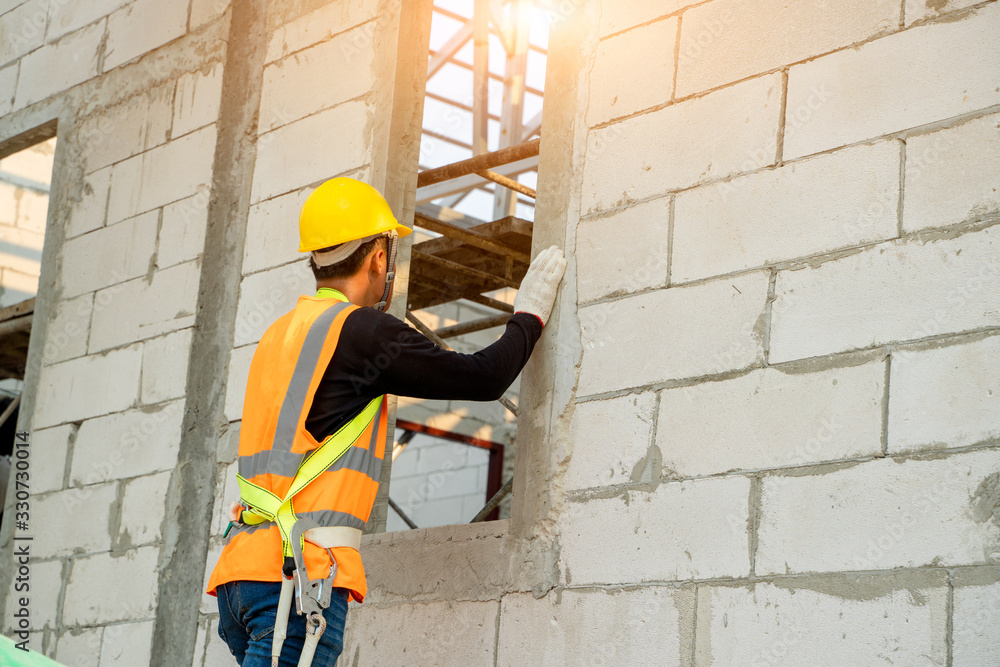 Engineer Industrial working for building exterior walls with ...