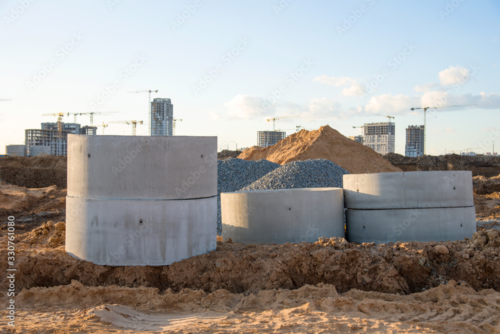 Laying concrete manholes and drain pipes for stormwater system ...