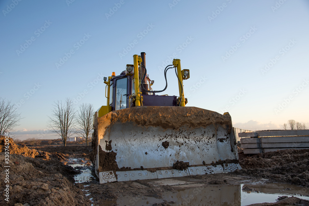 Dozer working at construction site. Bulldozer for land clearing ...