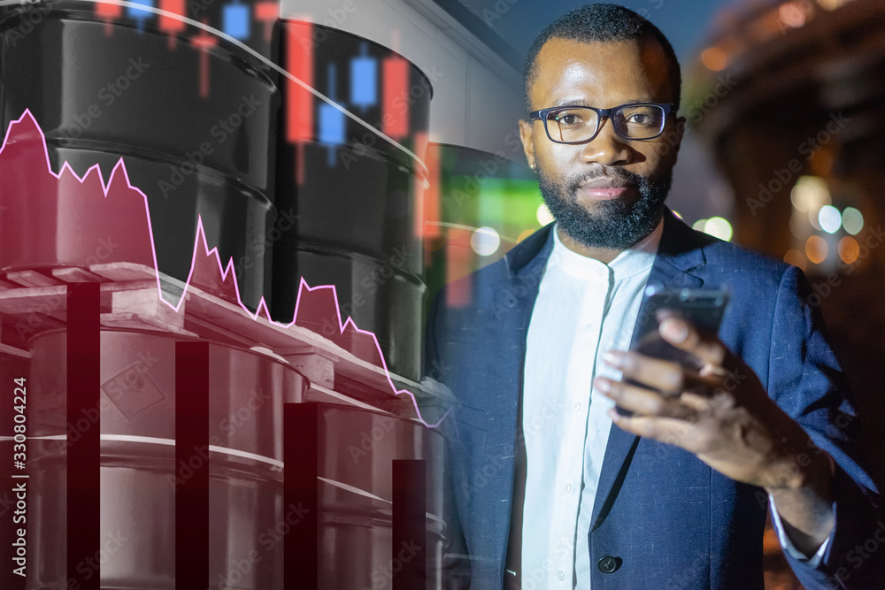 Barrels of crude oil. Young guy next to a falling chart. Concept - guy ...