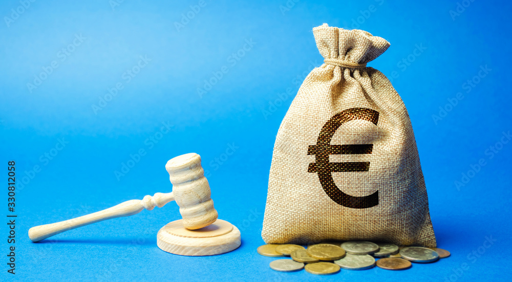 Money bag and judge's hammer. Penalty for a crime and offense ...